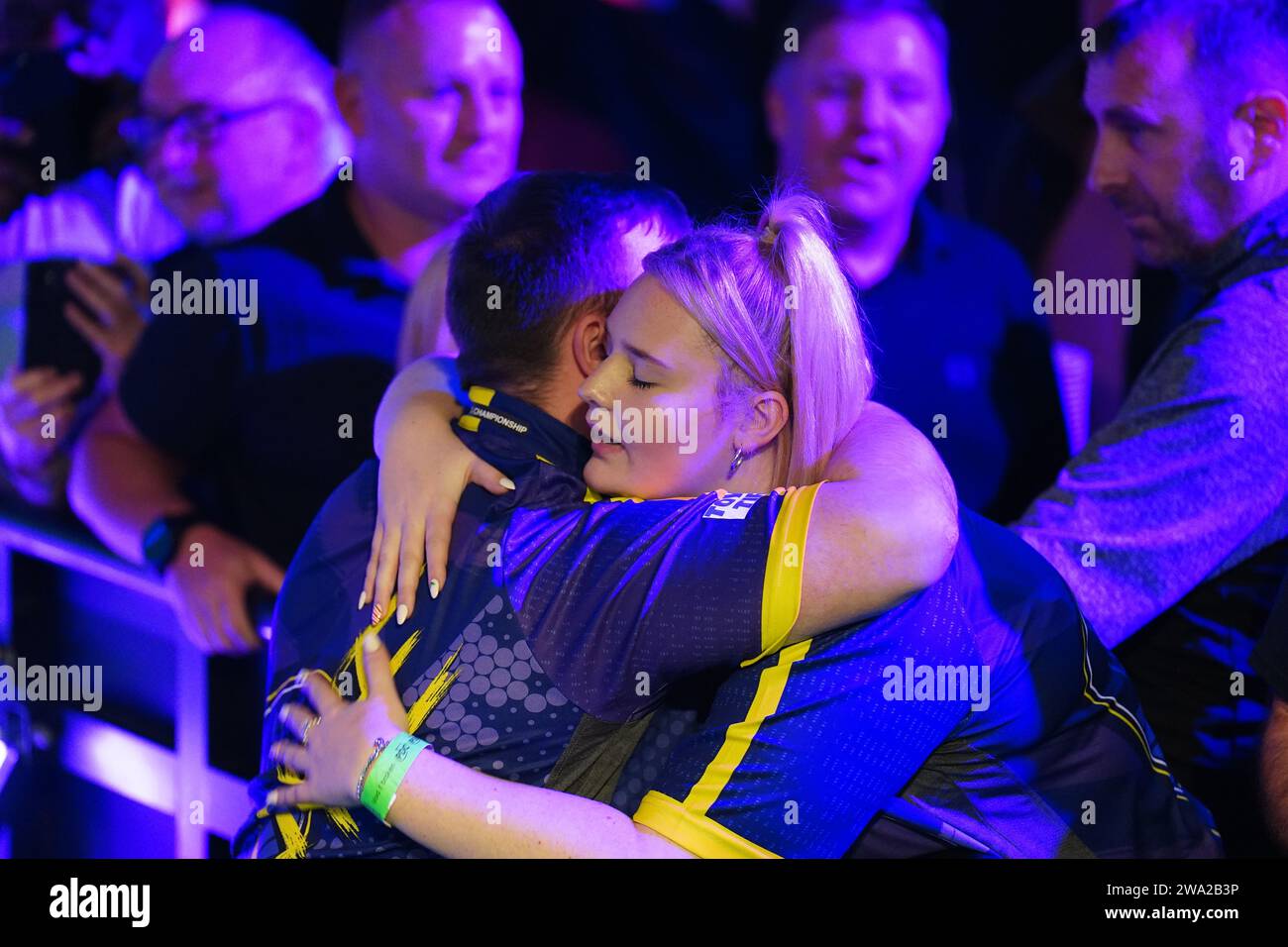 Luke Littler greets family before his match against Brendan Dolan (not ...