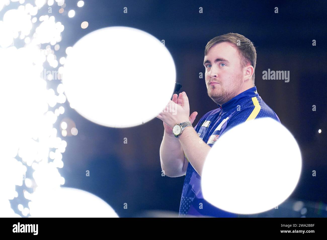 Luke Littler in action against Brendan Dolan (not pictured) on day ...