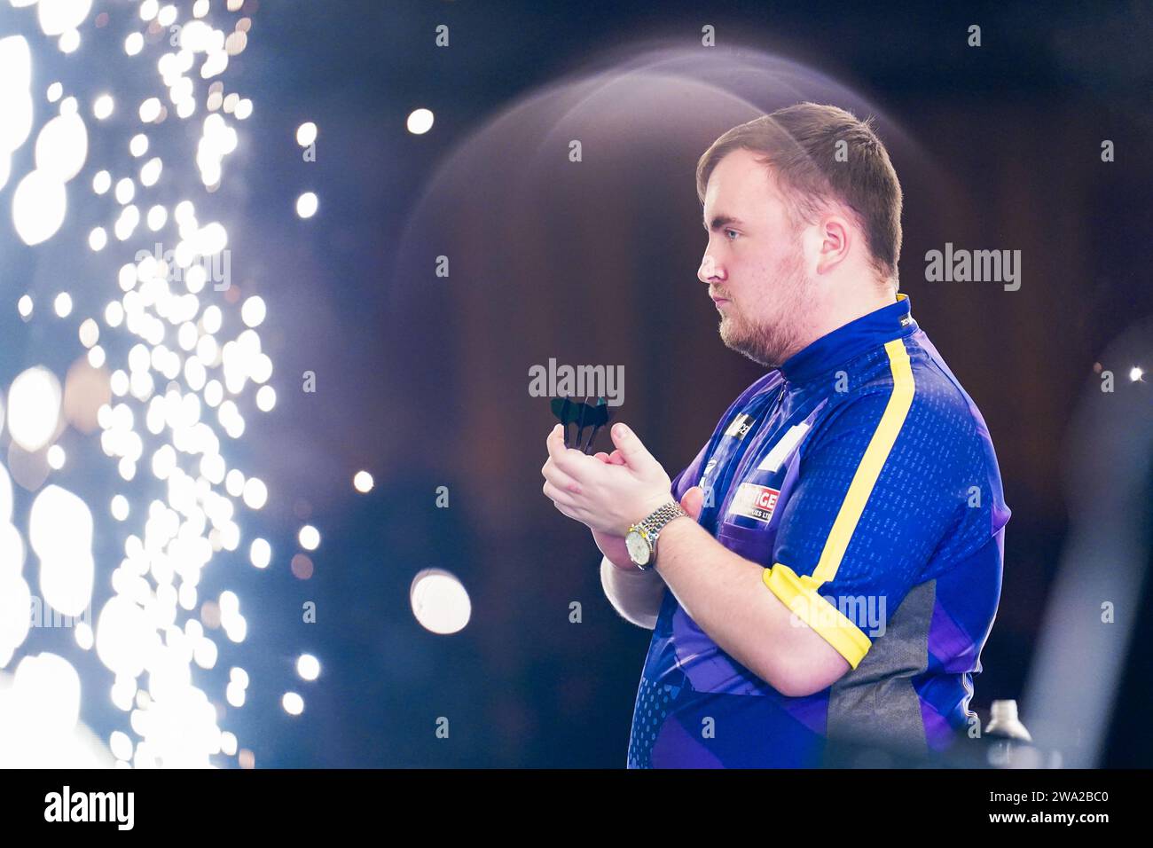 Luke Littler in action against Brendan Dolan (not pictured) on day ...