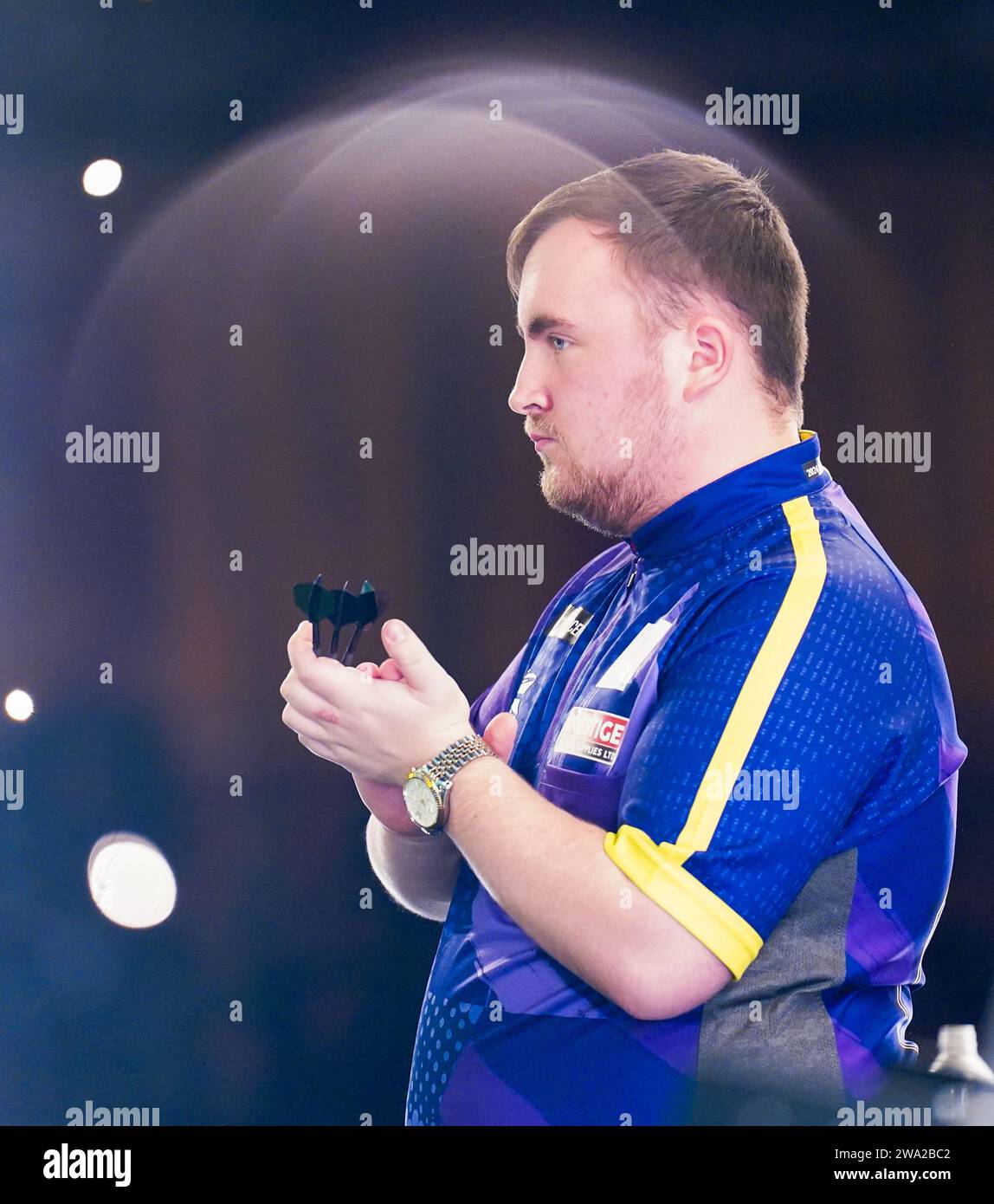 Luke Littler in action against Brendan Dolan (not pictured) on day ...