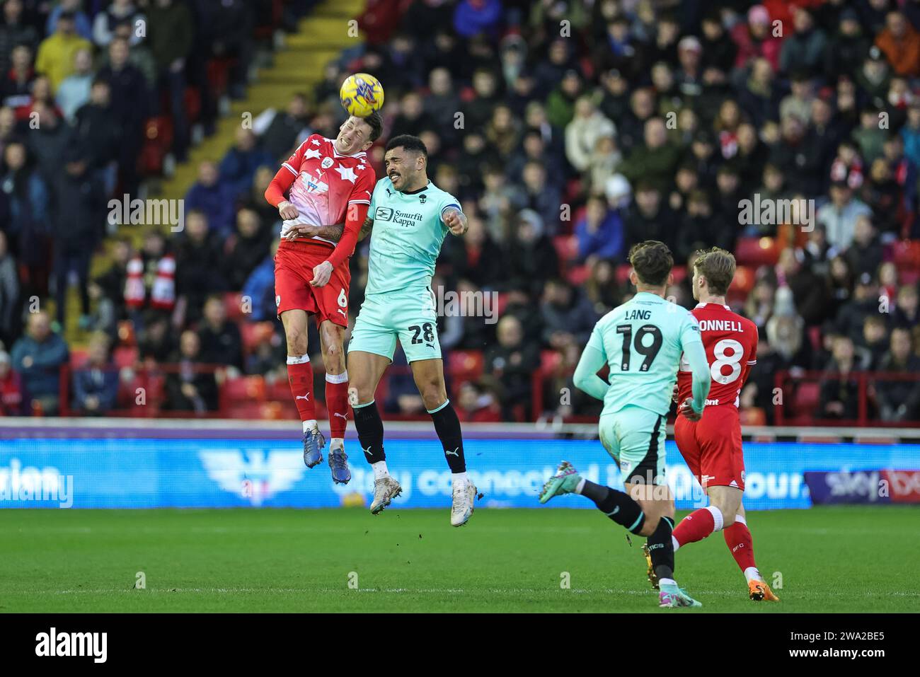 Barnsley, UK. 01st Jan, 2024. Maël de Gevigney of Barnsley jumps up to ...