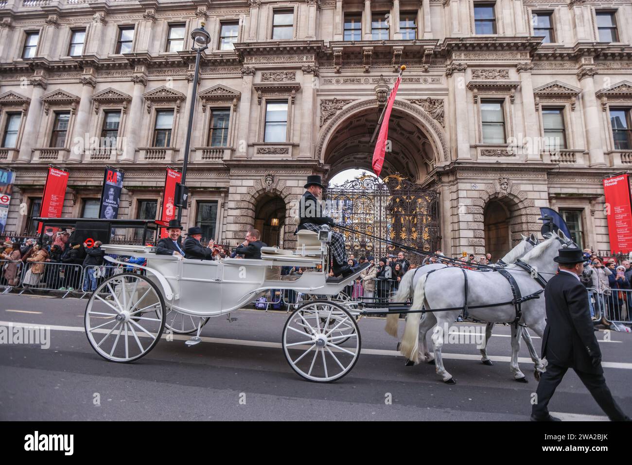 London, UK. 01st Jan, 2024. Crowds line up the streets of Central London today to enjoy The 37th ...
