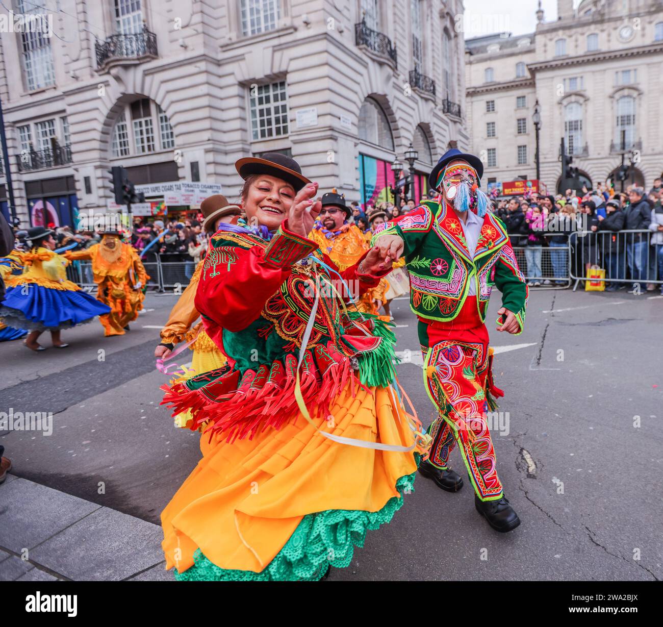 London, UK. 01st Jan, 2024. Crowds line up the streets of Central London today to enjoy The 37th ...
