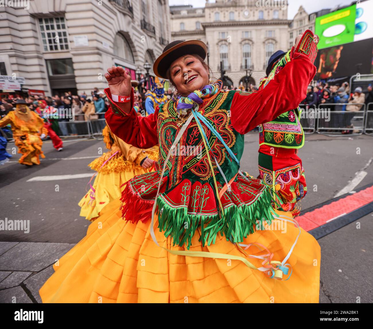 London, UK. 01st Jan, 2024. Crowds line up the streets of Central London today to enjoy The 37th ...