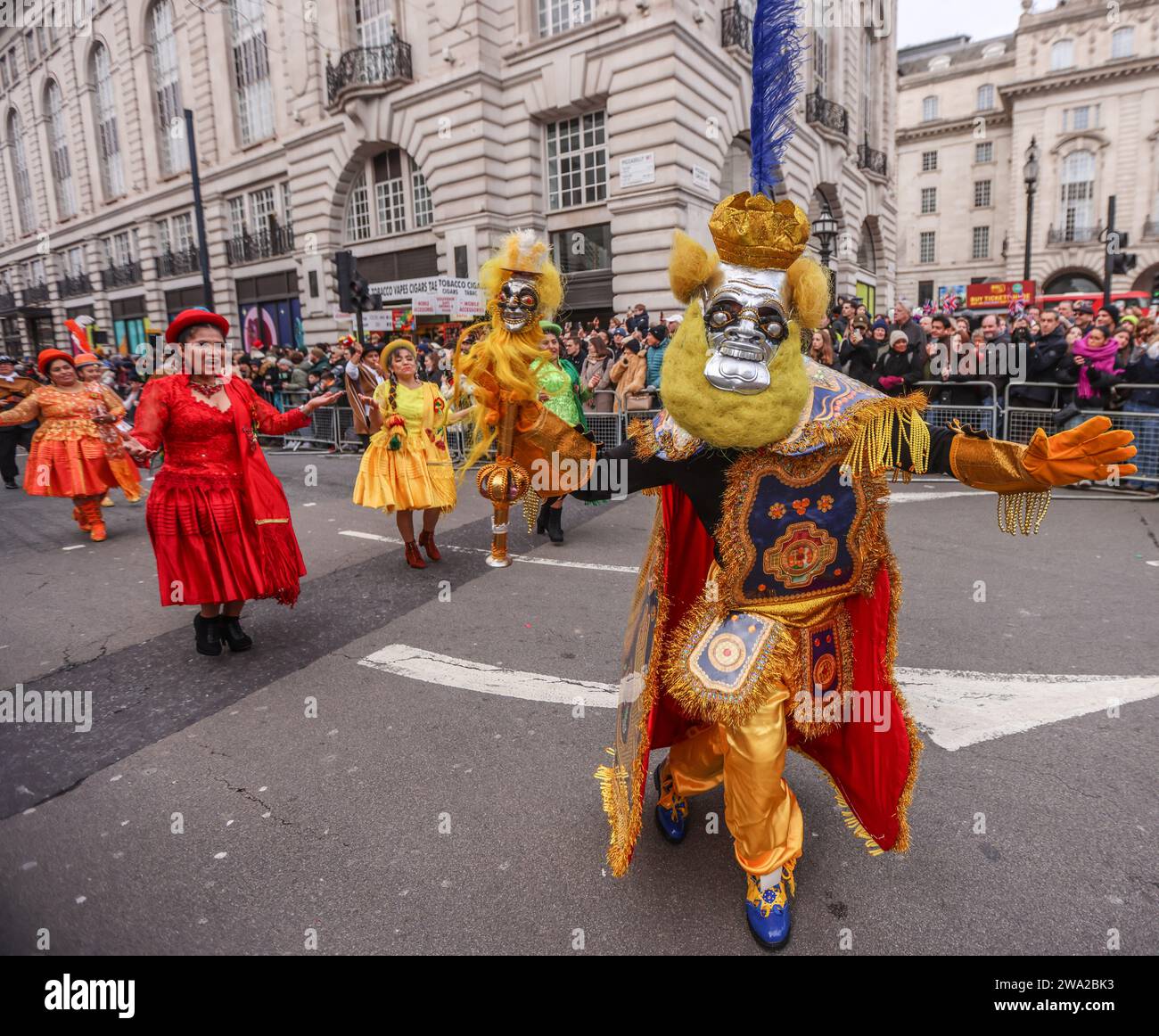 London, UK. 01st Jan, 2024. Crowds line up the streets of Central London today to enjoy The 37th ...