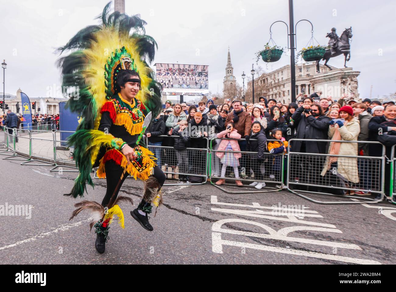 London, UK. 01st Jan, 2024. Crowds line up the streets of Central London today to enjoy The 37th ...