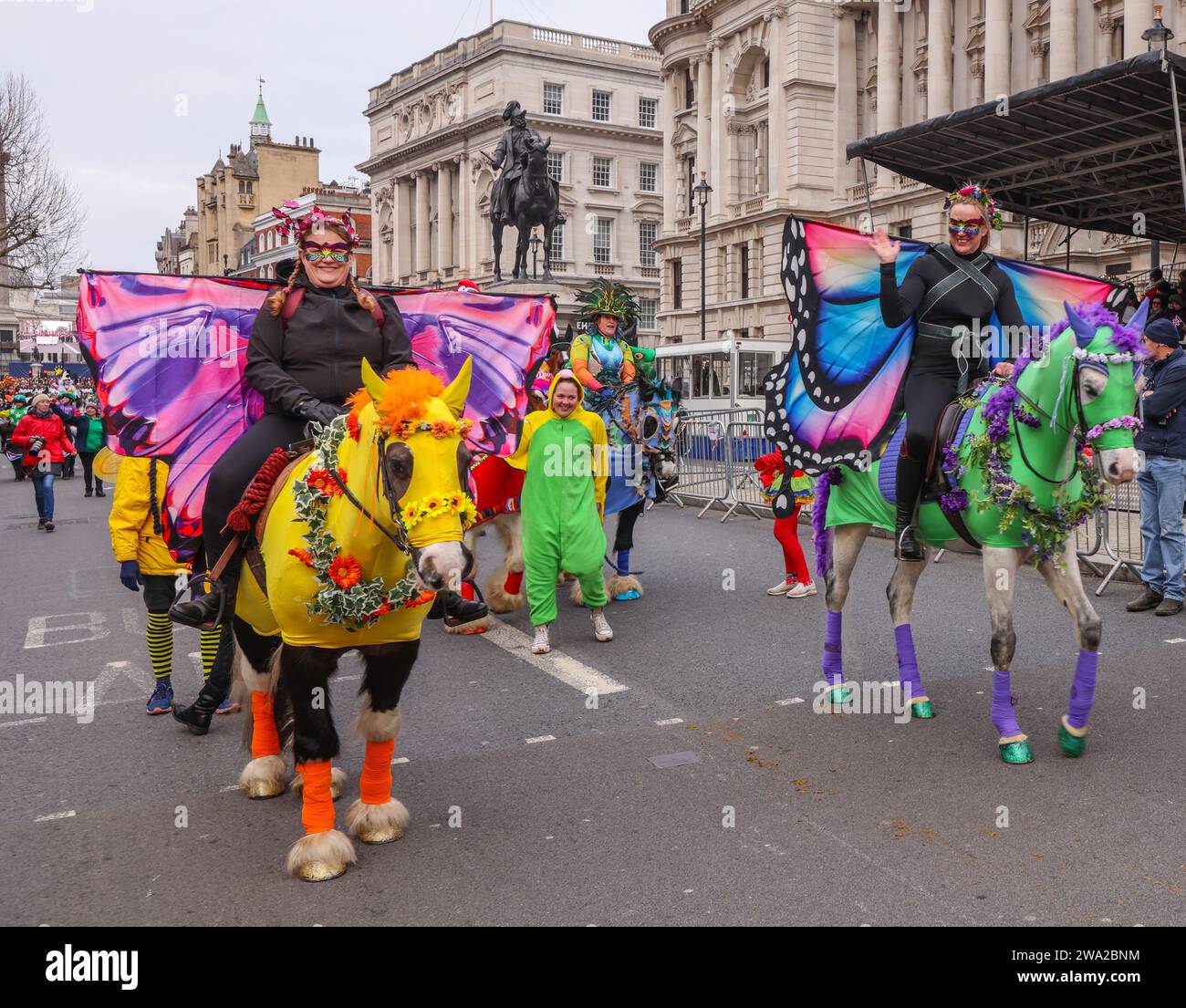 London, UK. 01st Jan, 2024. Crowds line up the streets of Central London today to enjoy The 37th ...