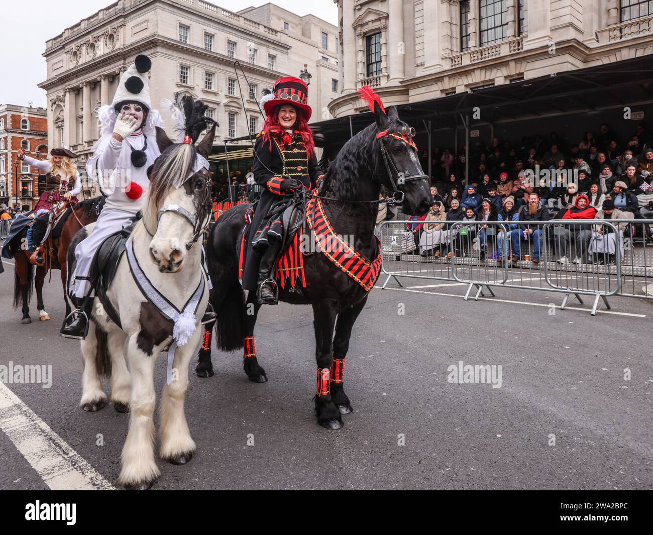 London, UK. 01st Jan, 2024. Crowds line up the streets of Central London today to enjoy The 37th ...