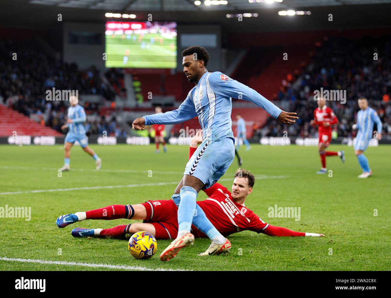 Coventry City's Haji Wright and Middlesbrough's Rav van den Berg battle ...