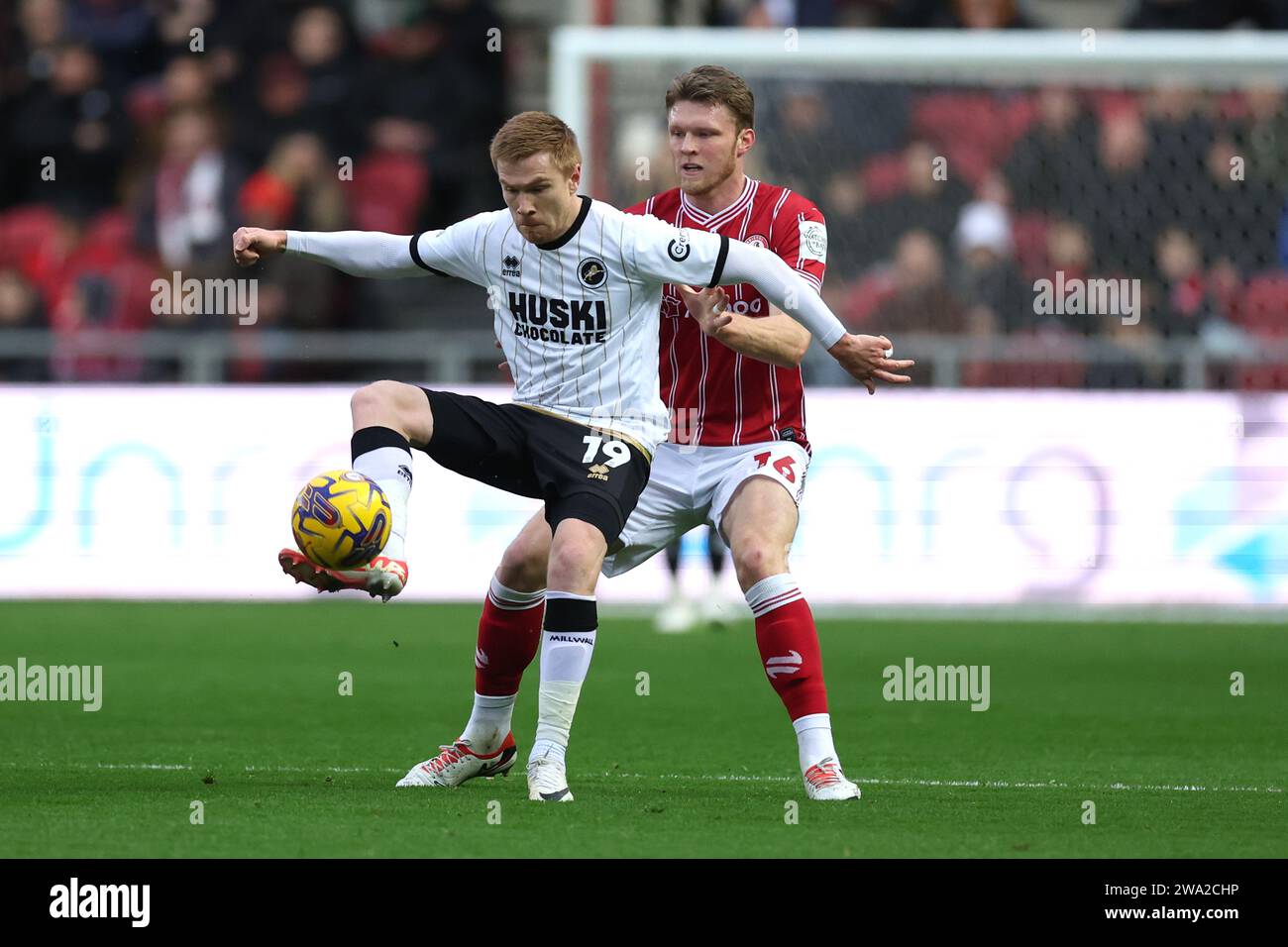 Millwalls Duncan Watmore Left And Bristol Citys Rob Dickie Battle For The Ball During The