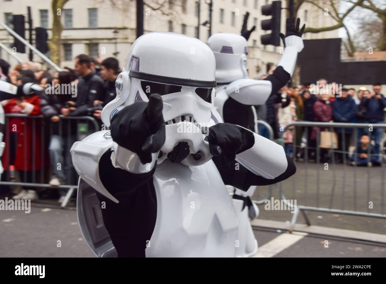 London, UK. 1st January 2024. Star Wars Stormtroopers pass through Whitehall during London's New ...