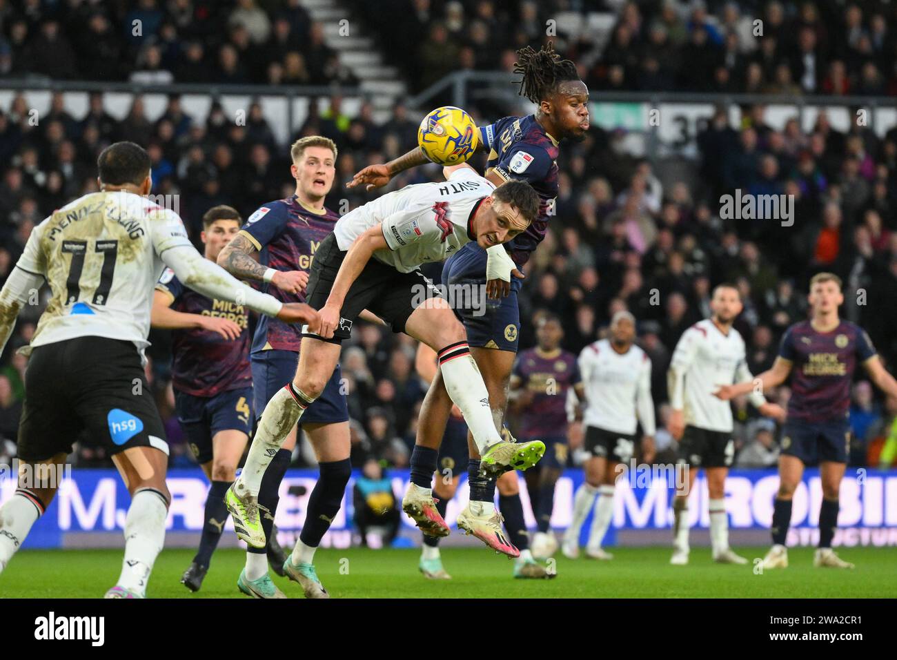 Derby on Monday 1st January 2024. Craig Forsyth of Derby County battle ...