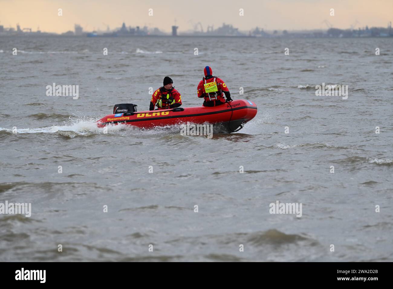 Butjadingen, Germany. 01st Jan, 2024. The DLRG water line accompanies ...