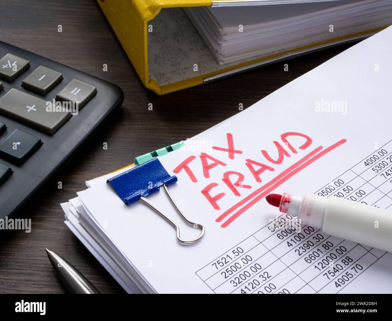 Financial reporting and marking tax fraud Stock Photo - Alamy