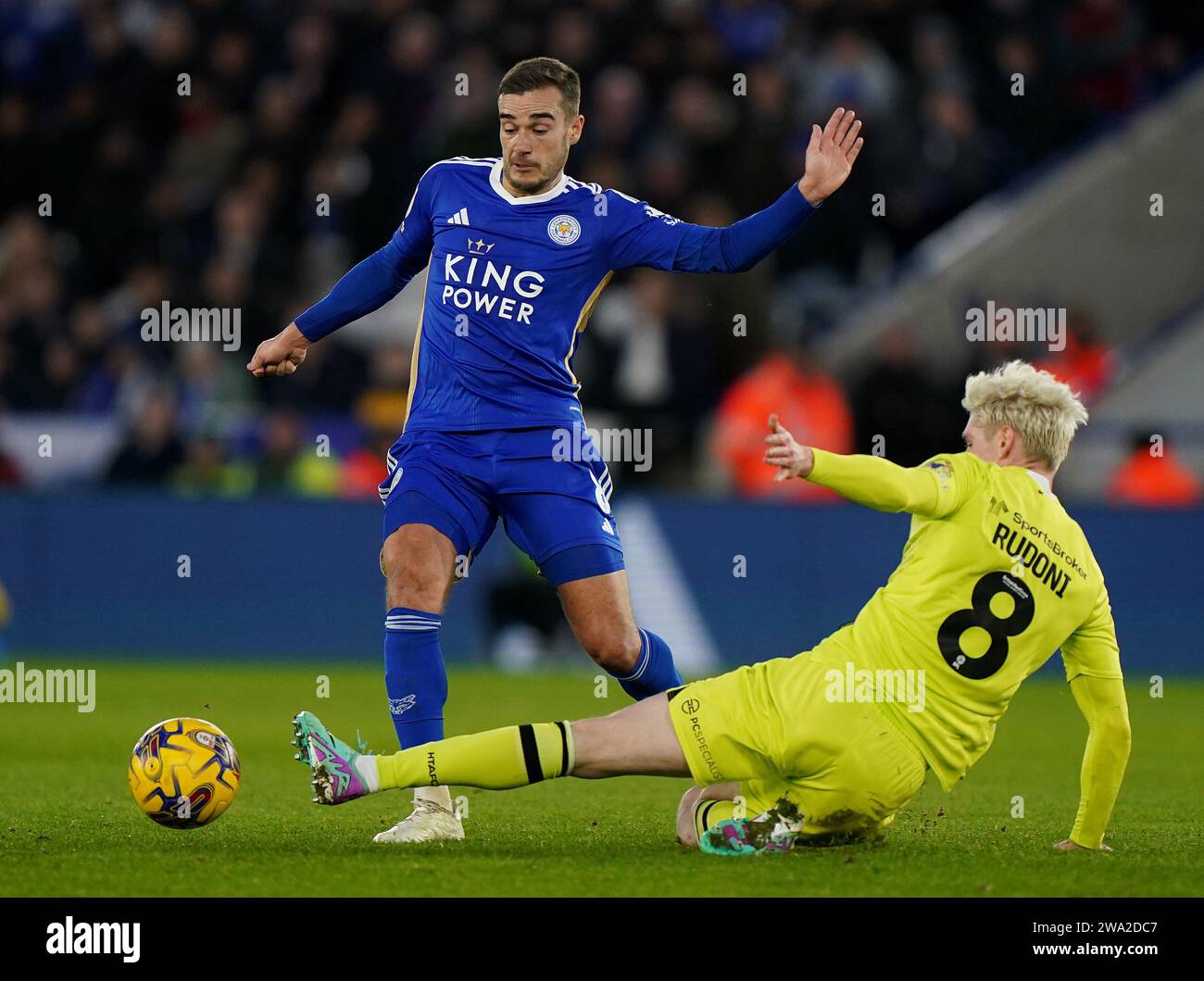 Leicester City's Harry Winks (left) is tackled by Huddersfield Town's ...