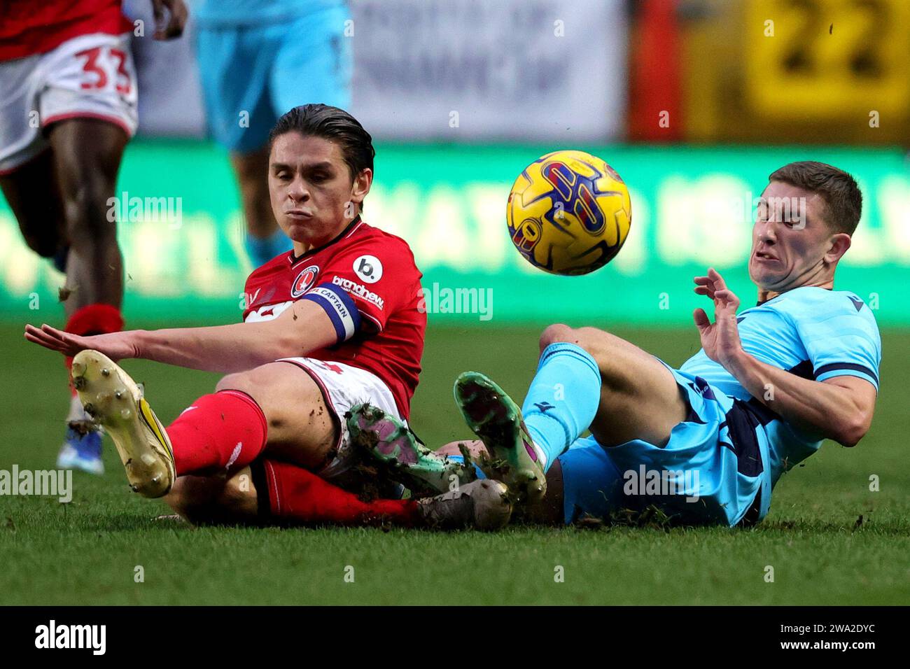 Charlton Athletic's George Dobson (left) with Oxford United's Cameron ...