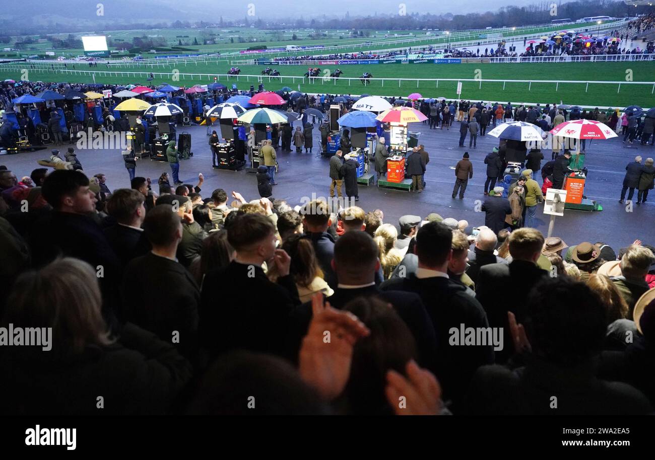 Race goers shelter while watching The Family Fun "Junior" National Hunt ...