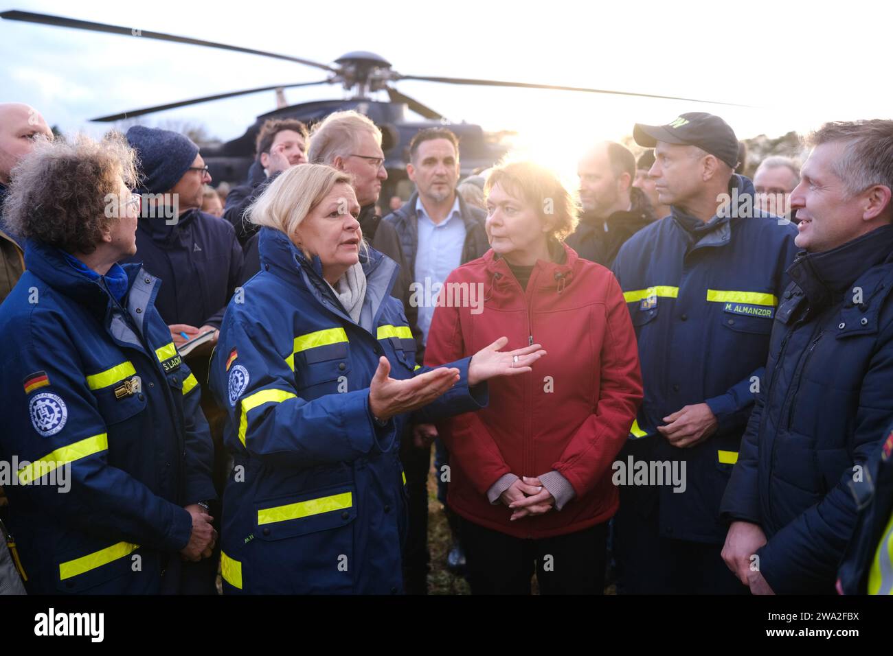 Sandkrug, Germany. 01st Jan, 2024. Federal Minister of the Interior Nancy Faeser (SPD, 2nd from ...