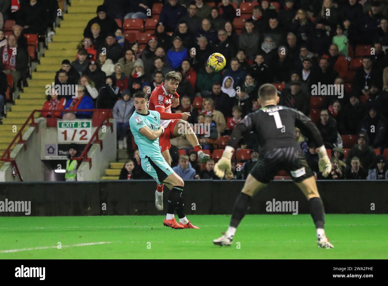 John Mcatee of Barnsley takes a shot on goal and puts it just over the ...