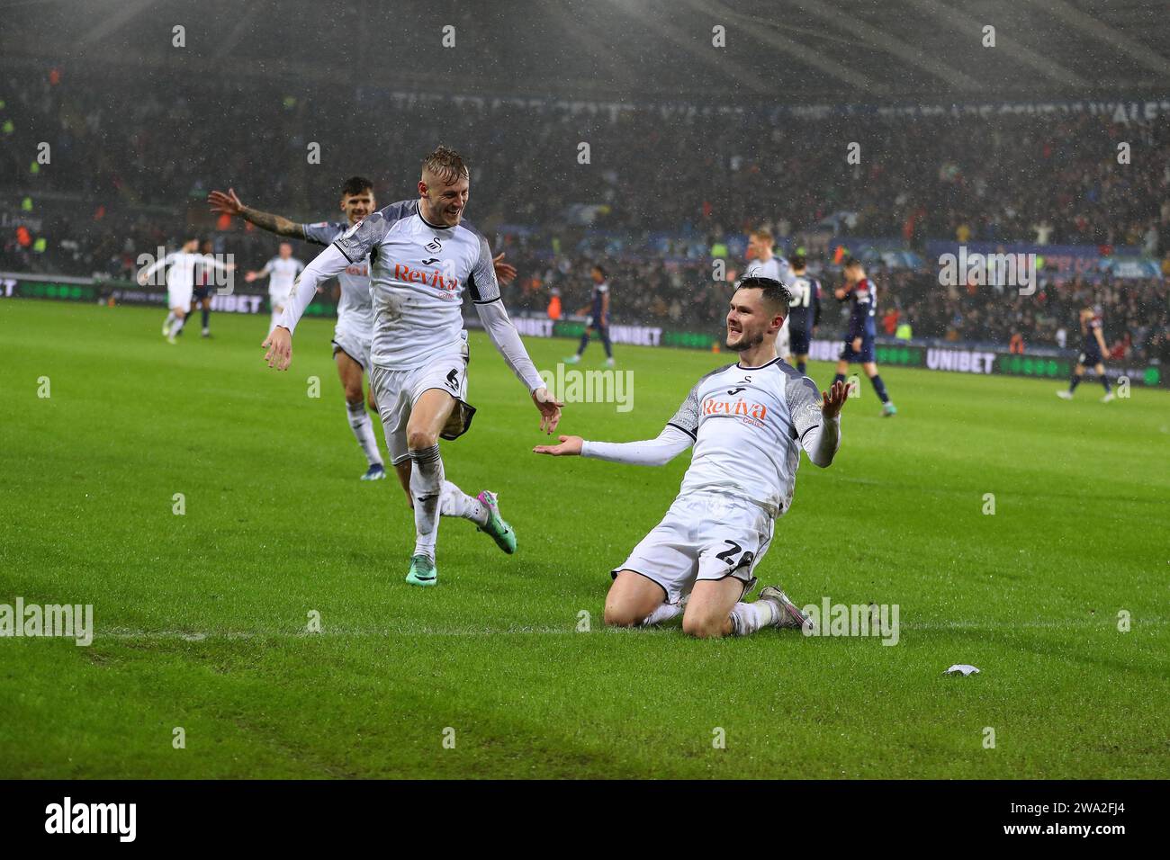 Swansea, UK. 01st Jan, 2024. Liam Cullen of Swansea city celebrates ...