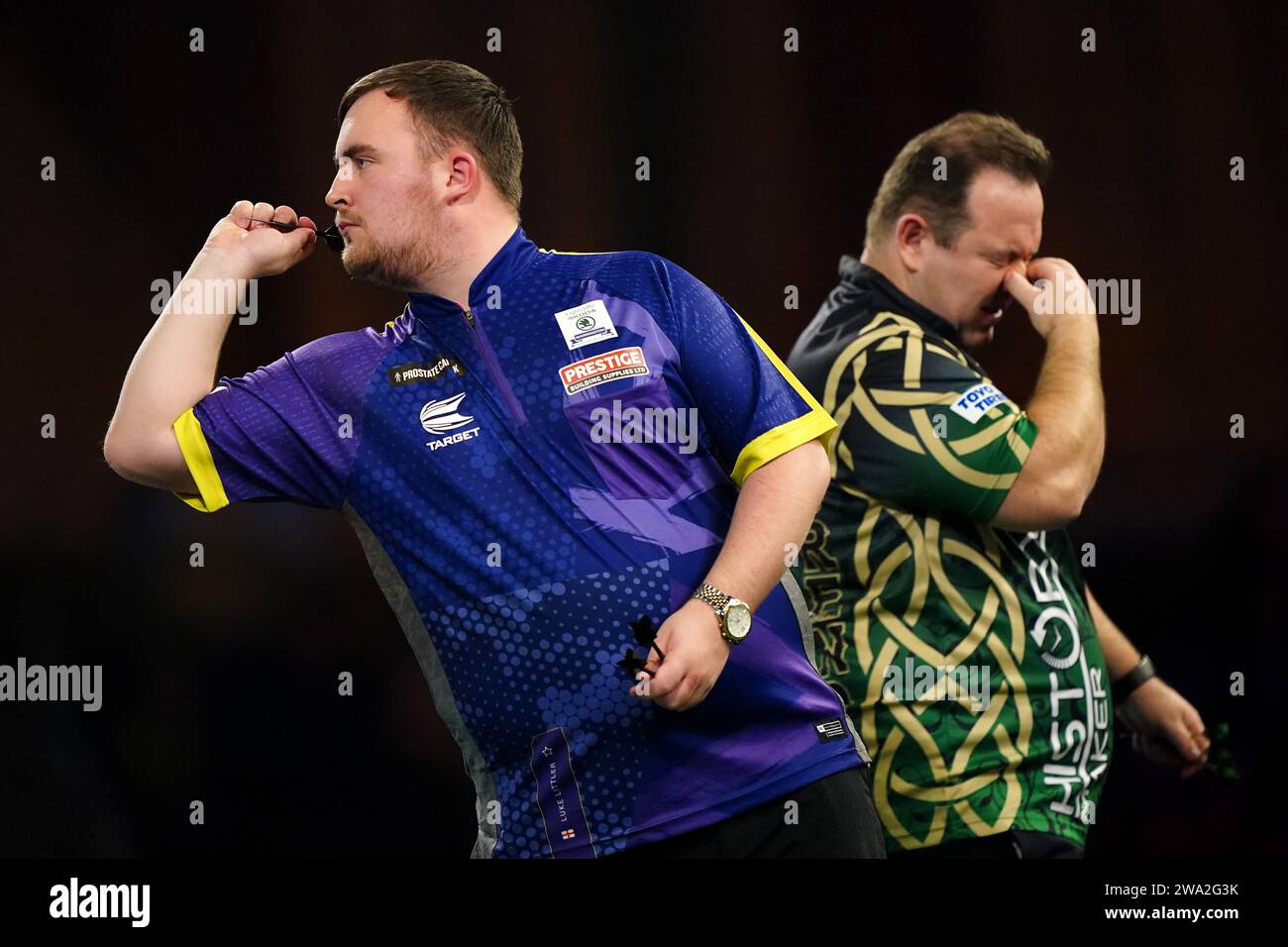 Luke Littler in action against Brendan Dolan (not pictured) on day ...