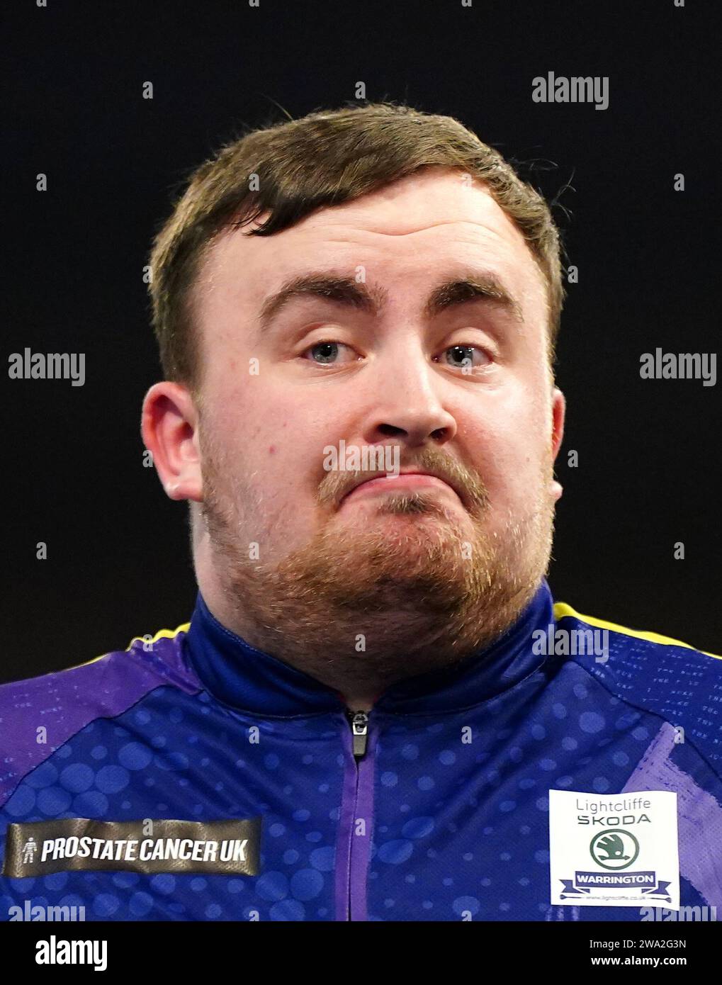 Luke Littler in action against Brendan Dolan (not pictured) on day ...