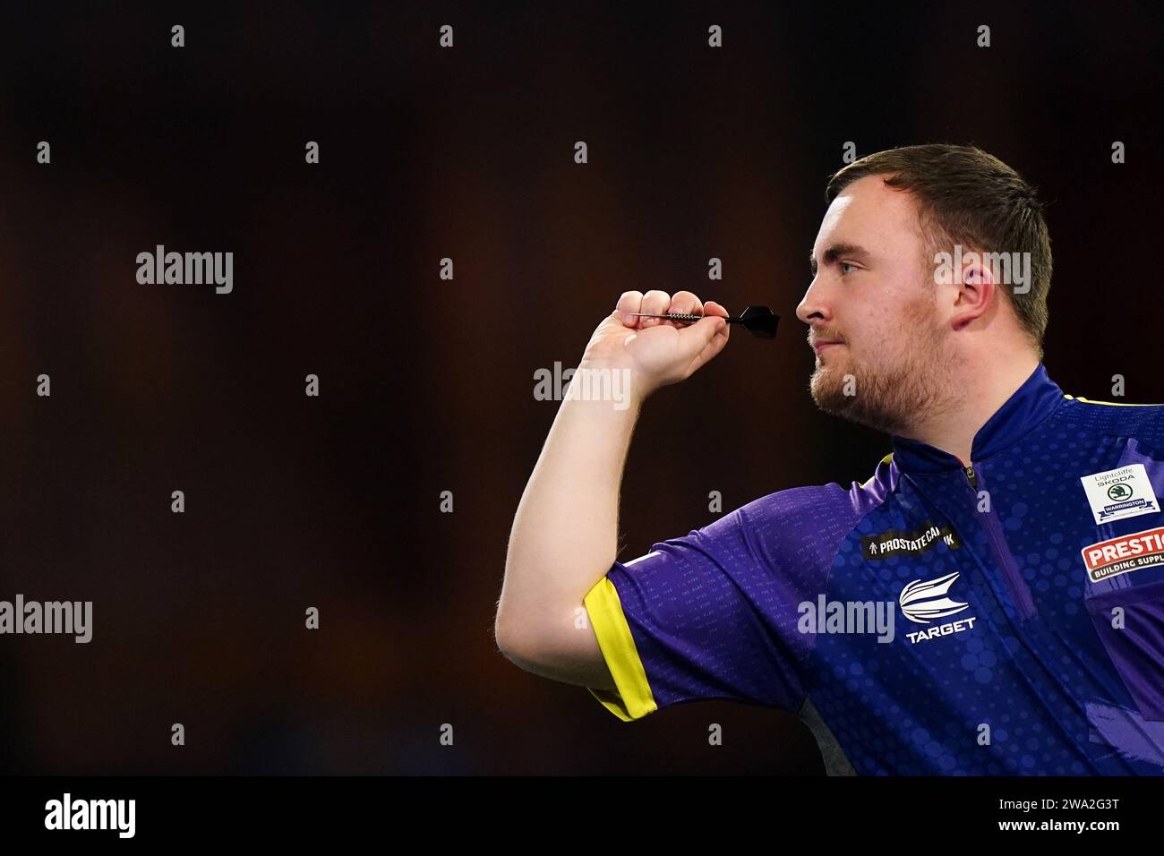 Luke Littler in action against Brendan Dolan (not pictured) on day ...