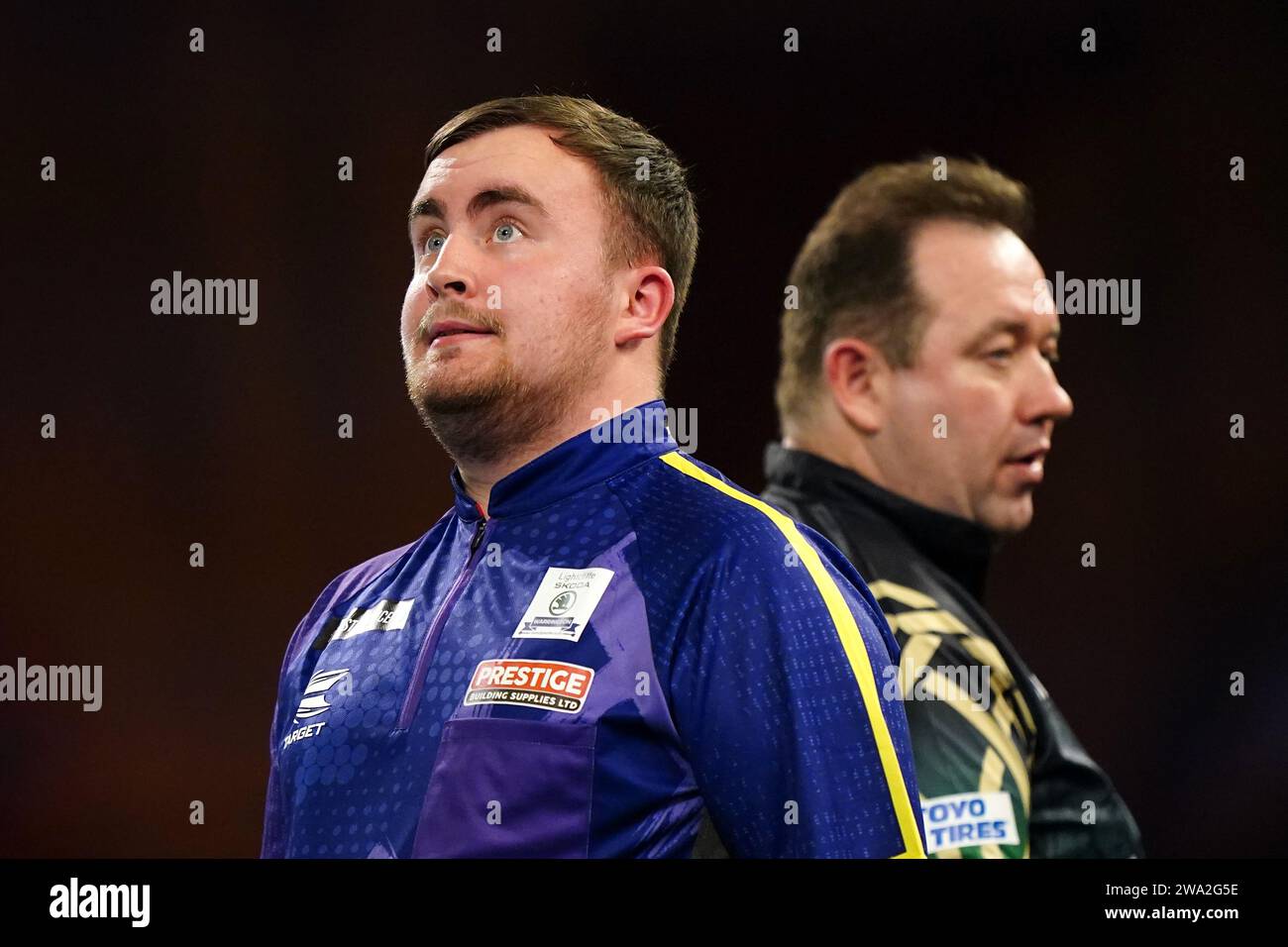 Luke Littler in action against Brendan Dolan (not pictured) on day ...