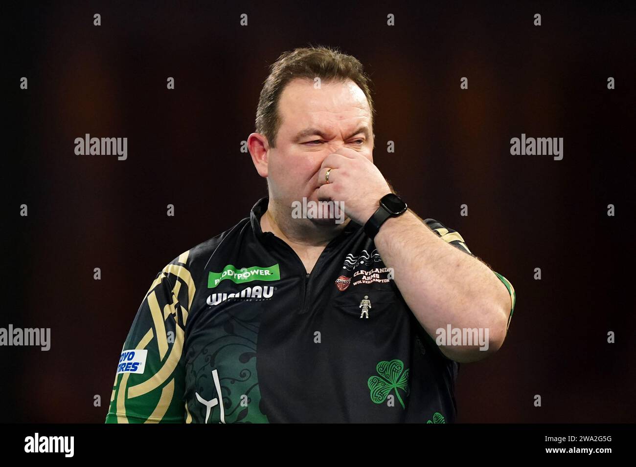 Brendan Dolan in action against Luke Littler (not pictured) on day ...