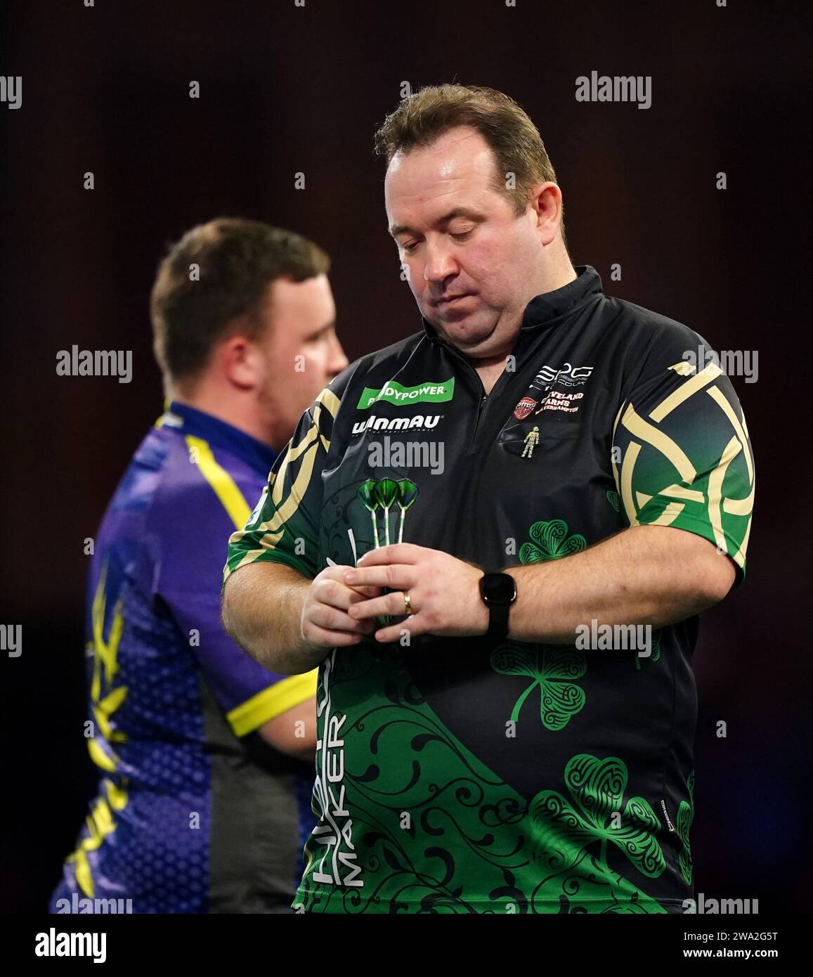Brendan Dolan in action against Luke Littler (not pictured) on day ...