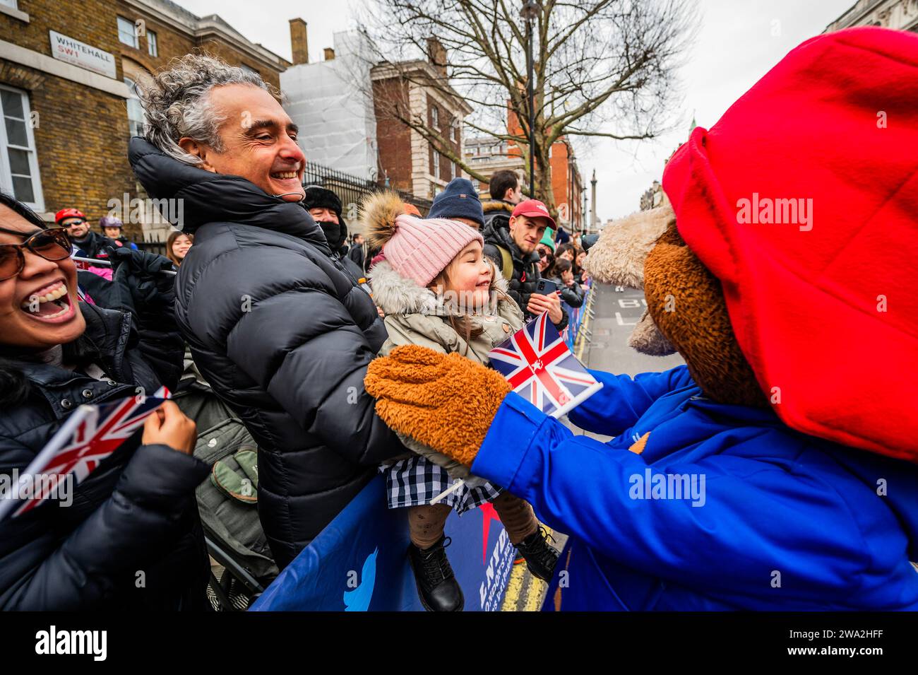 London, UK. 1st Jan, 2024. Paddington shows the love to the crowd - The London New Year's Day ...