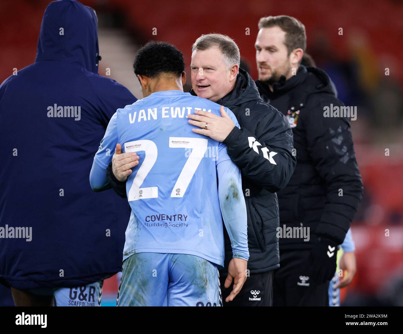 Coventry City manager Mark Robins greets Milan van Ewijk following the ...
