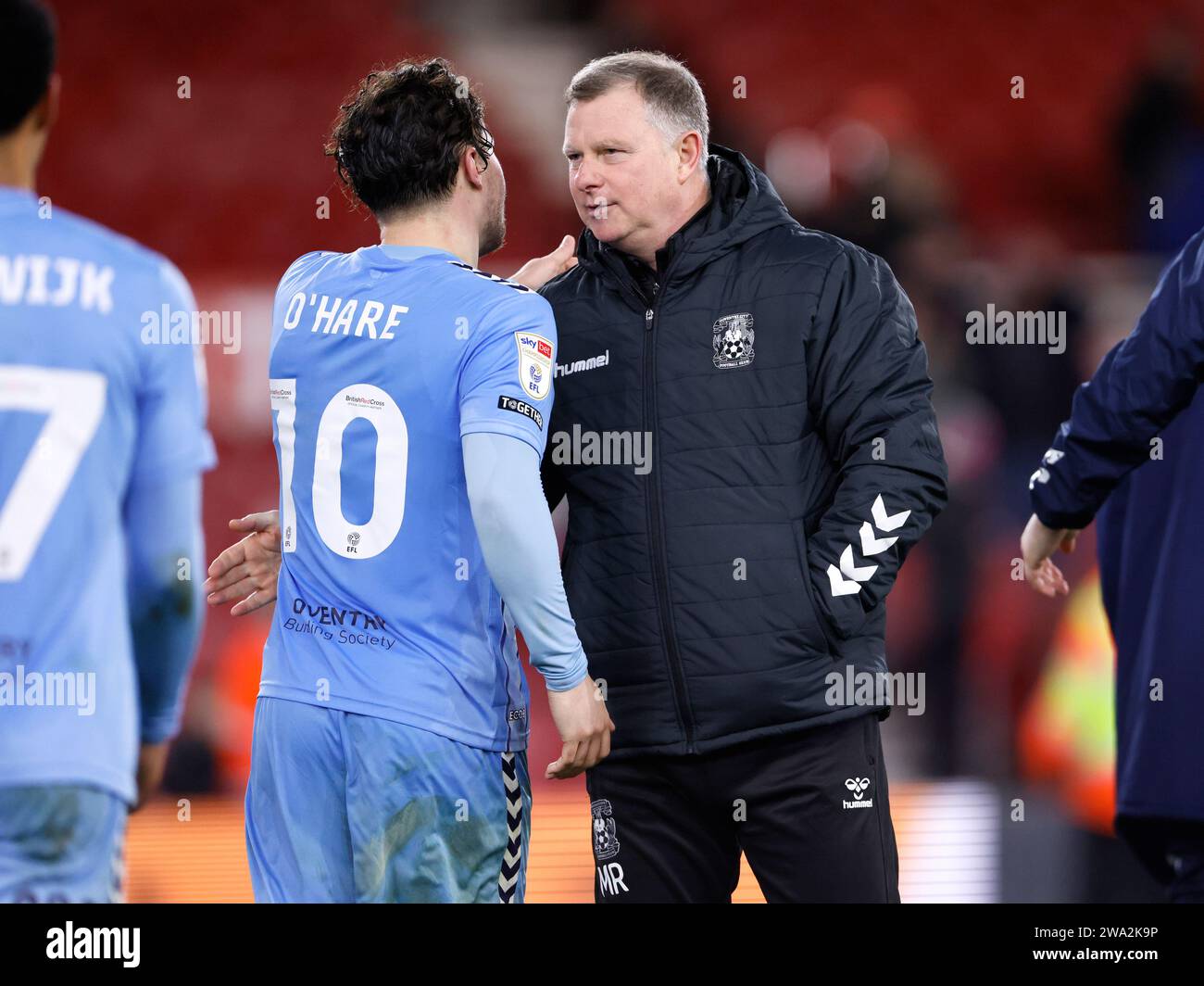 Coventry City manager Mark Robins greets Callum O'Hare following the ...