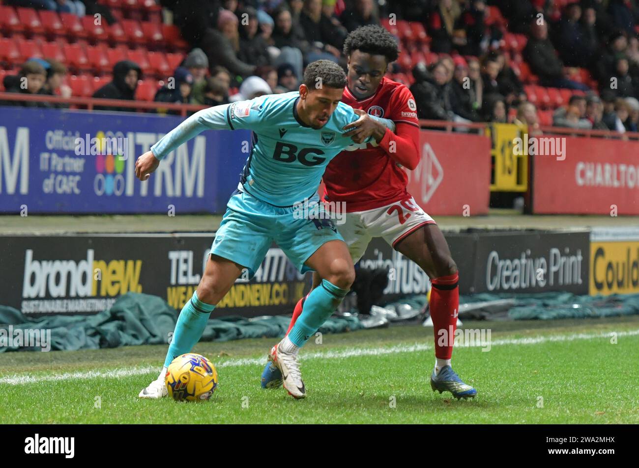 London, England. 1st Jan 2024. Marcus McGuane of Oxford United battles ...