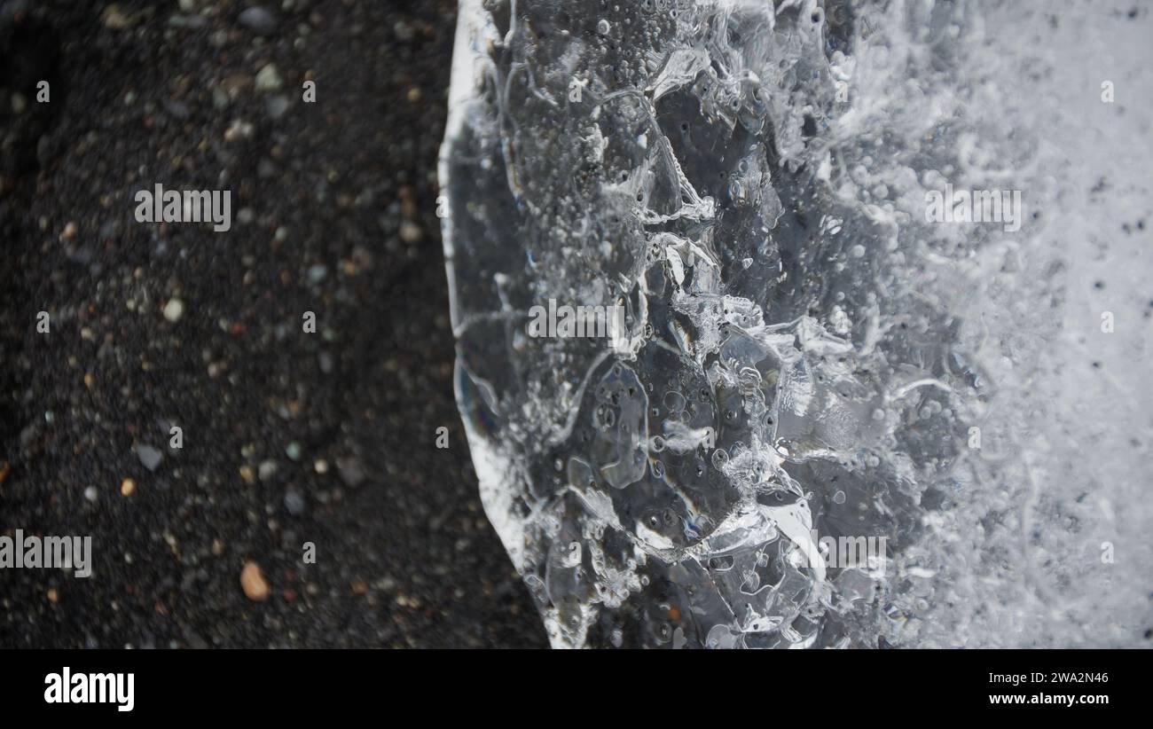Black sand meets ice Stock Photo - Alamy