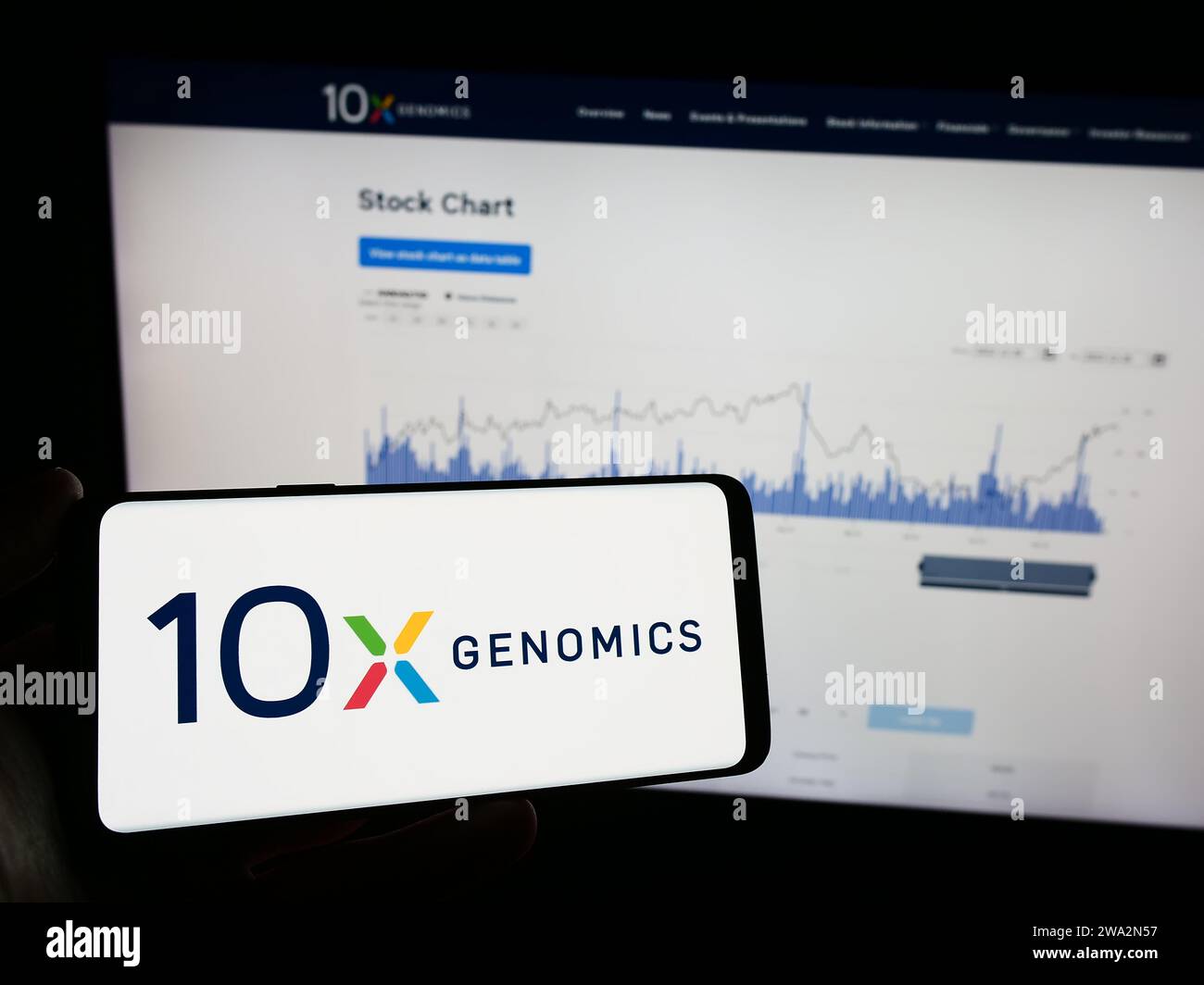 Person holding mobile phone with logo of American biotechnology company ...