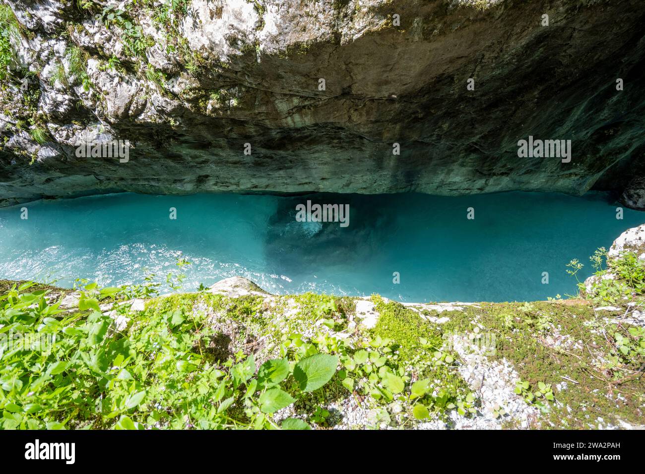 Fallen off, submerged rock lying on the bottom of crystal clear Soca ...