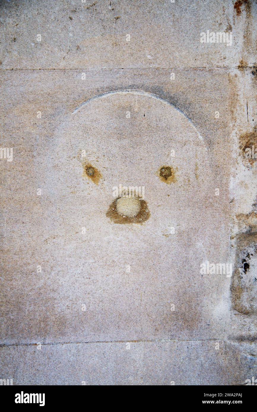 "Ghost" snowman image as marks left by fittings removed from a stone ...