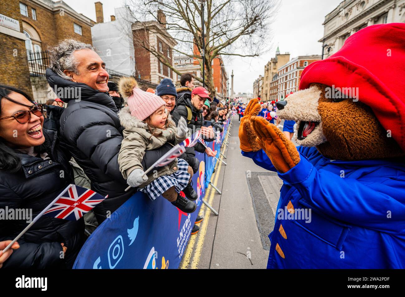 London, UK. 1st Jan, 2024. Paddington shows the love to the crowd - The London New Year's Day ...