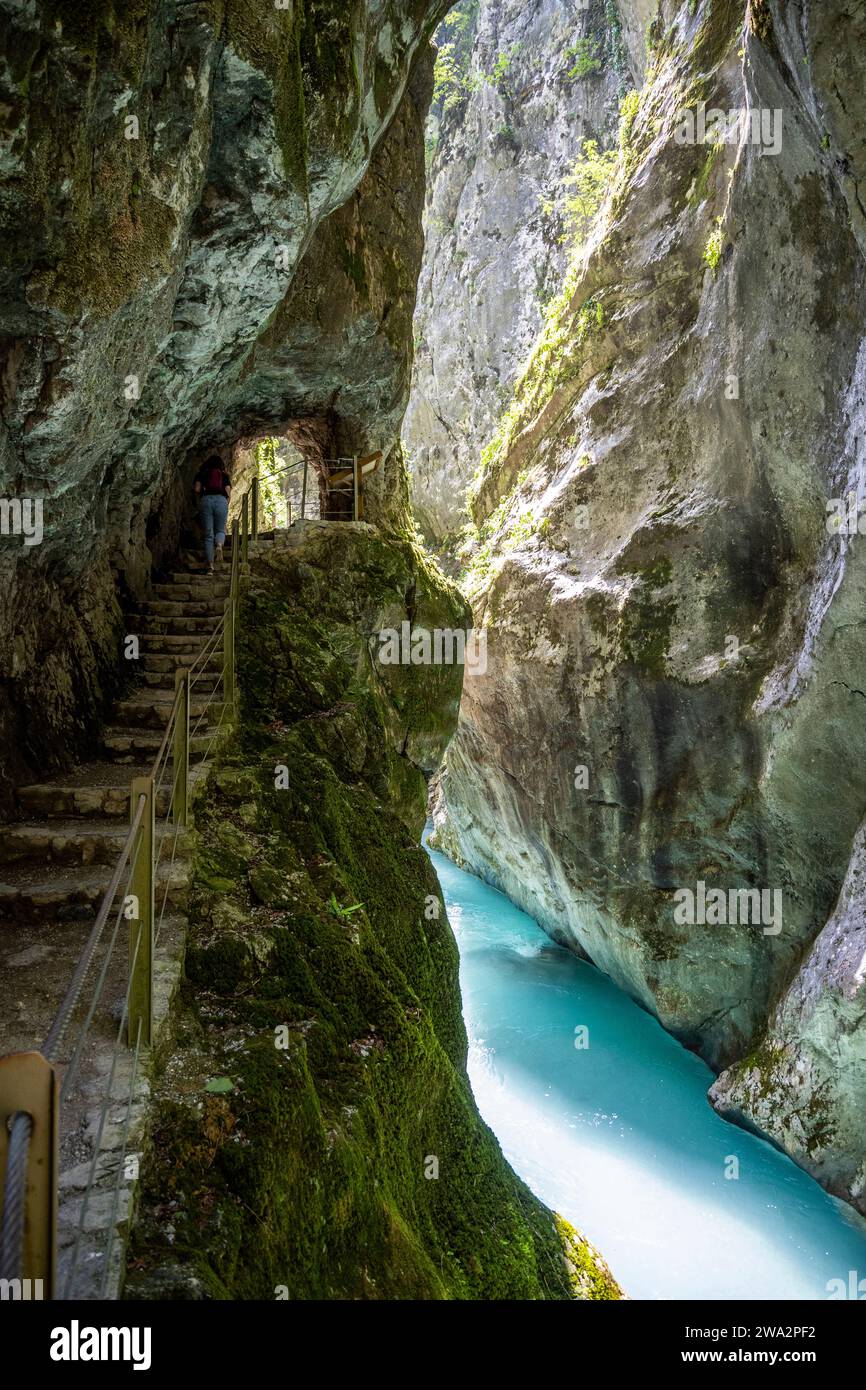 Beautiful tunnel leading through the steep, rocky cliffs of Soca river ...