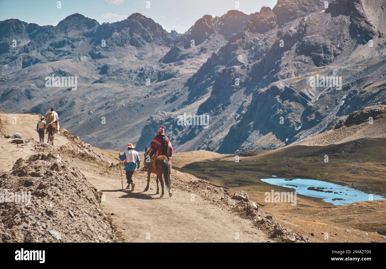 Peruvian Andean man wearing traditional colorful clothing walking up ...