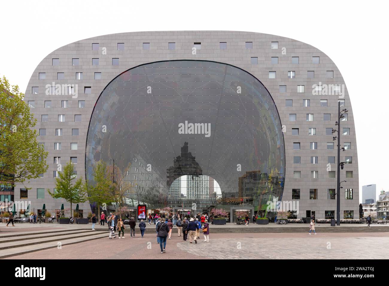 Modern residential and retail building with indoor market hall in the ...