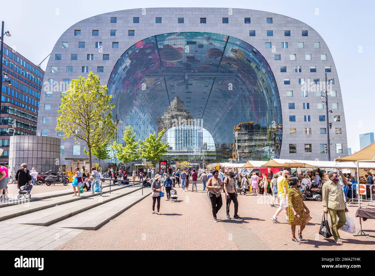 Modern residential and retail building with indoor market hall in the ...