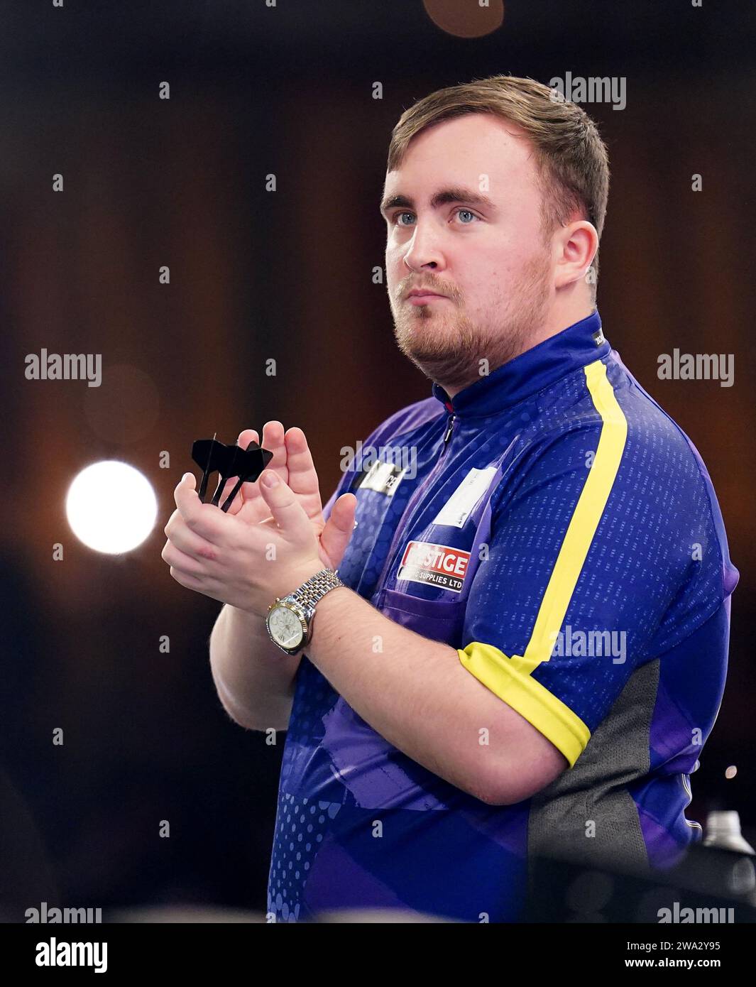 Luke Littler in action against Brendan Dolan (not pictured) on day ...