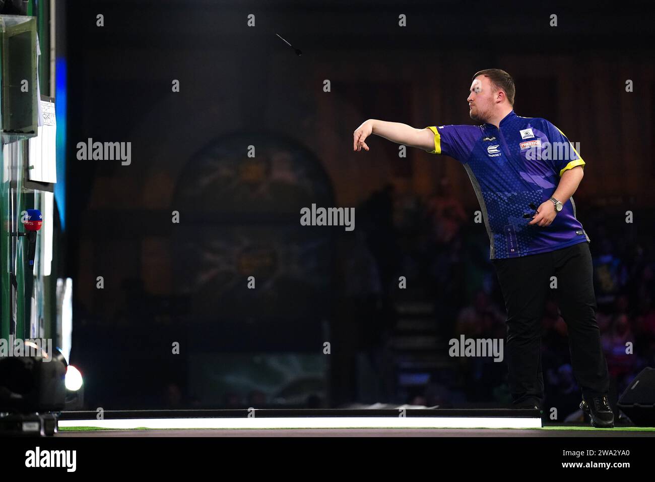 Luke Littler in action against Brendan Dolan (not pictured) on day ...