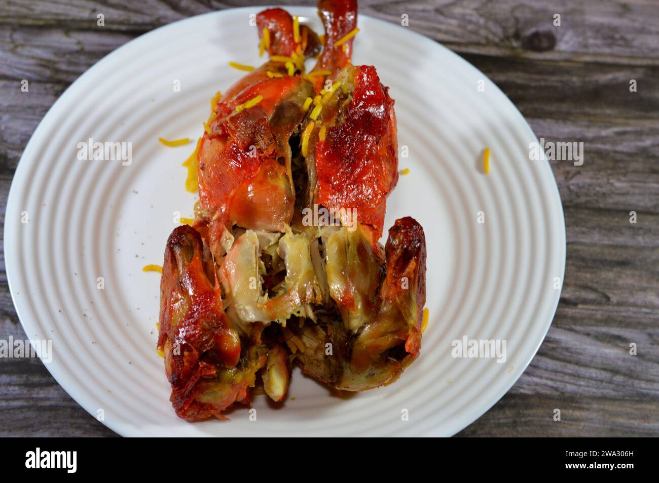 Gulf cuisine of Mandi cooked chicken, a whole chicken made in a Mandi ...