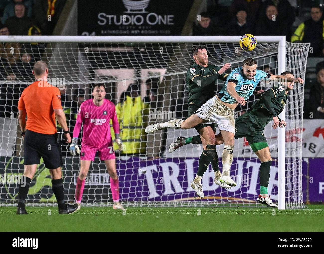 Dan Scarr of Plymouth Argyle heads the ball during the Sky Bet ...