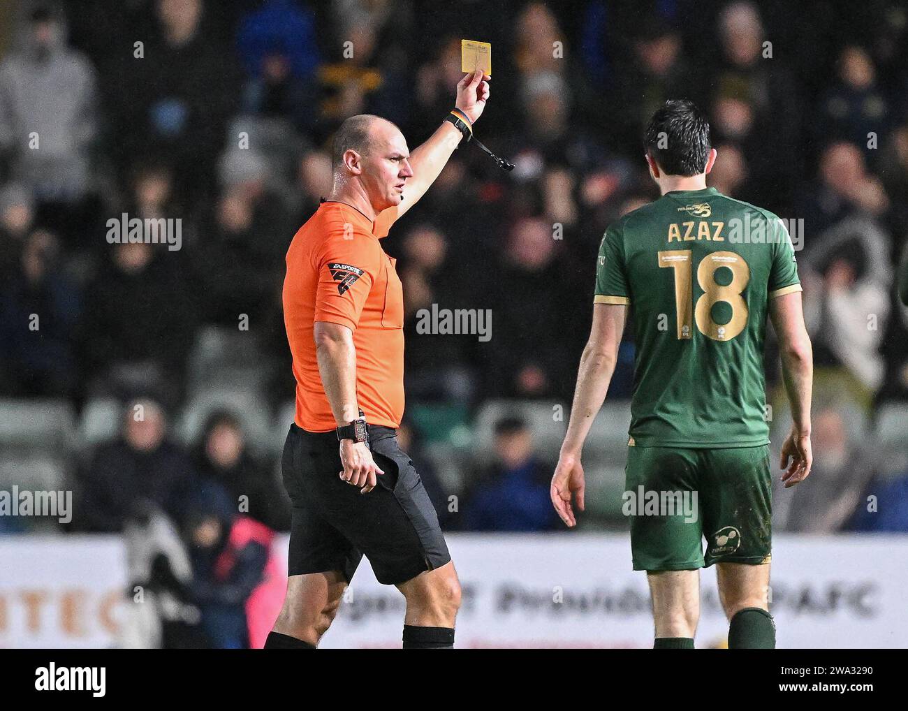 Match referee ROBERT MADLEY shows a yellow card to Finn Azaz of ...