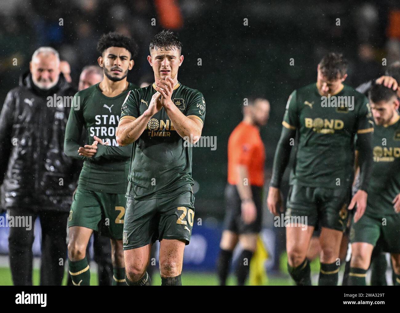 Adam Randell of Plymouth Argyle applauds the fans at full time looks ...