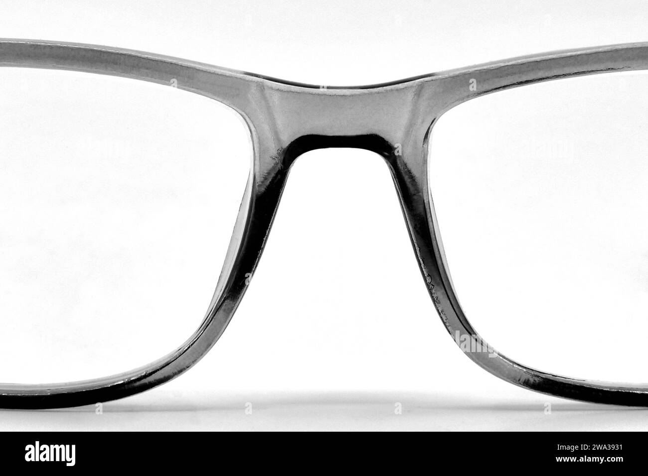 Close up view of a pair of glasses isolated on a plain white background ...
